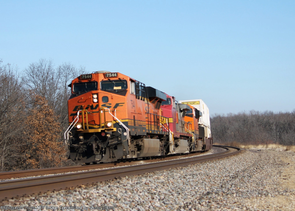 BNSF 7544 rips stacks west.